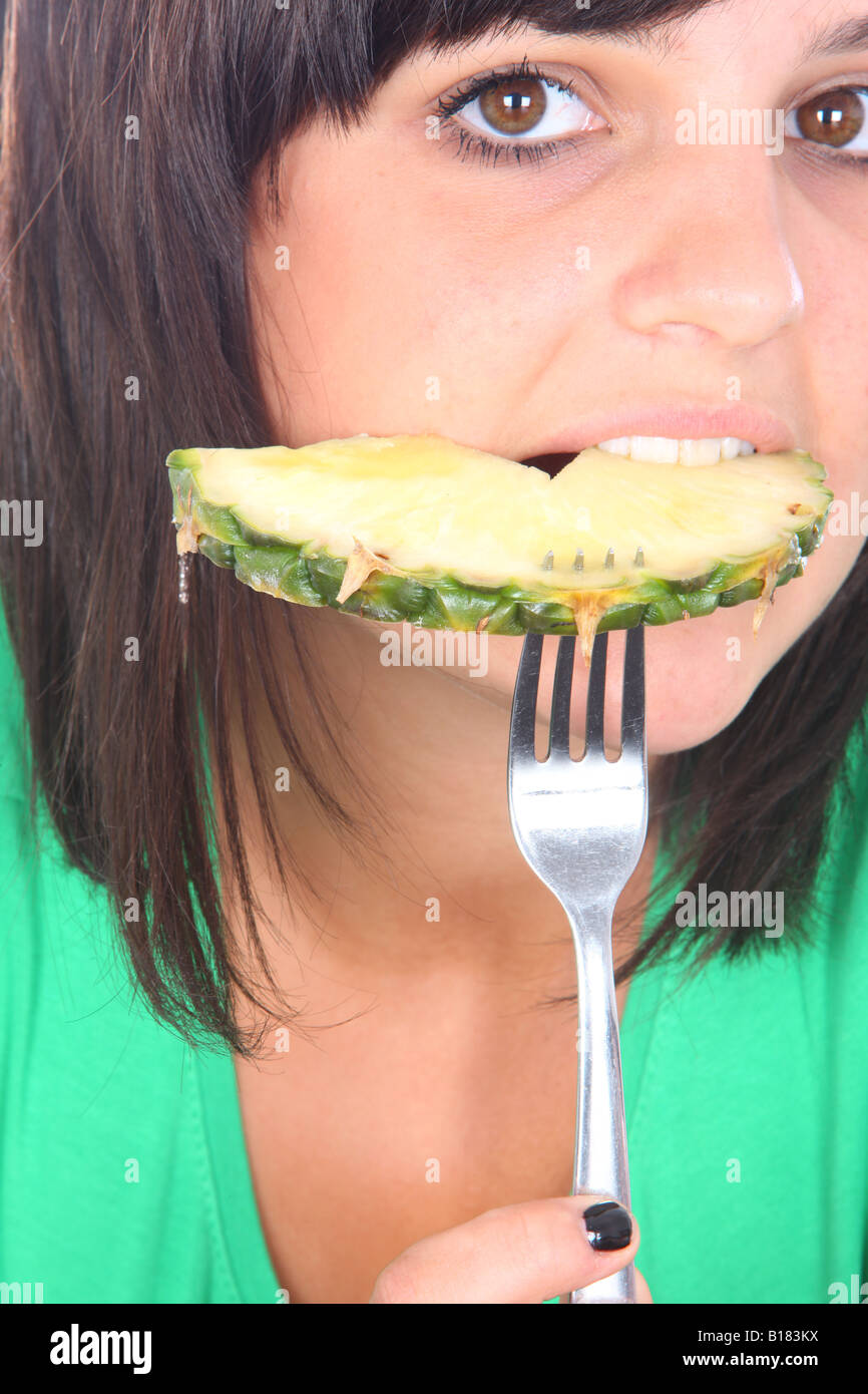 Young Woman Eating Pineapples Model Released Stock Photo - Alamy