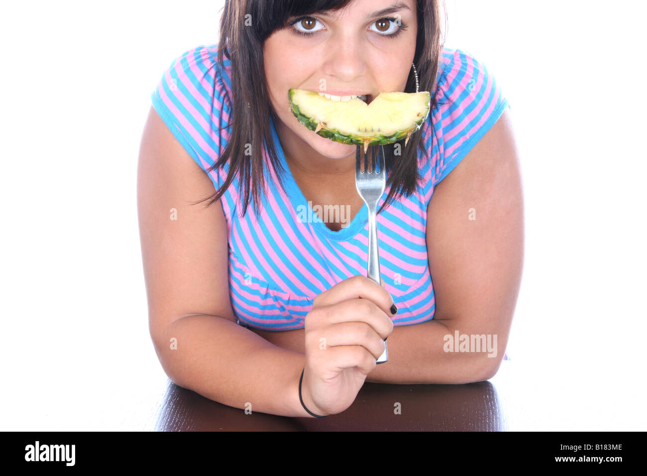 Young Woman Eating Pineapples Model Released Stock Photo - Alamy
