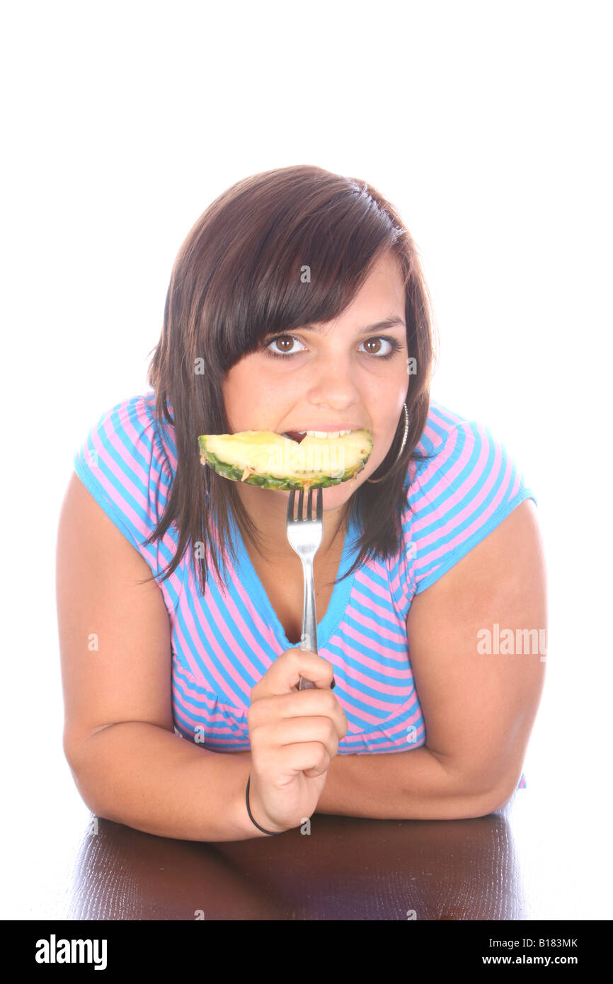 Young Woman Eating Pineapples Model Released Stock Photo - Alamy