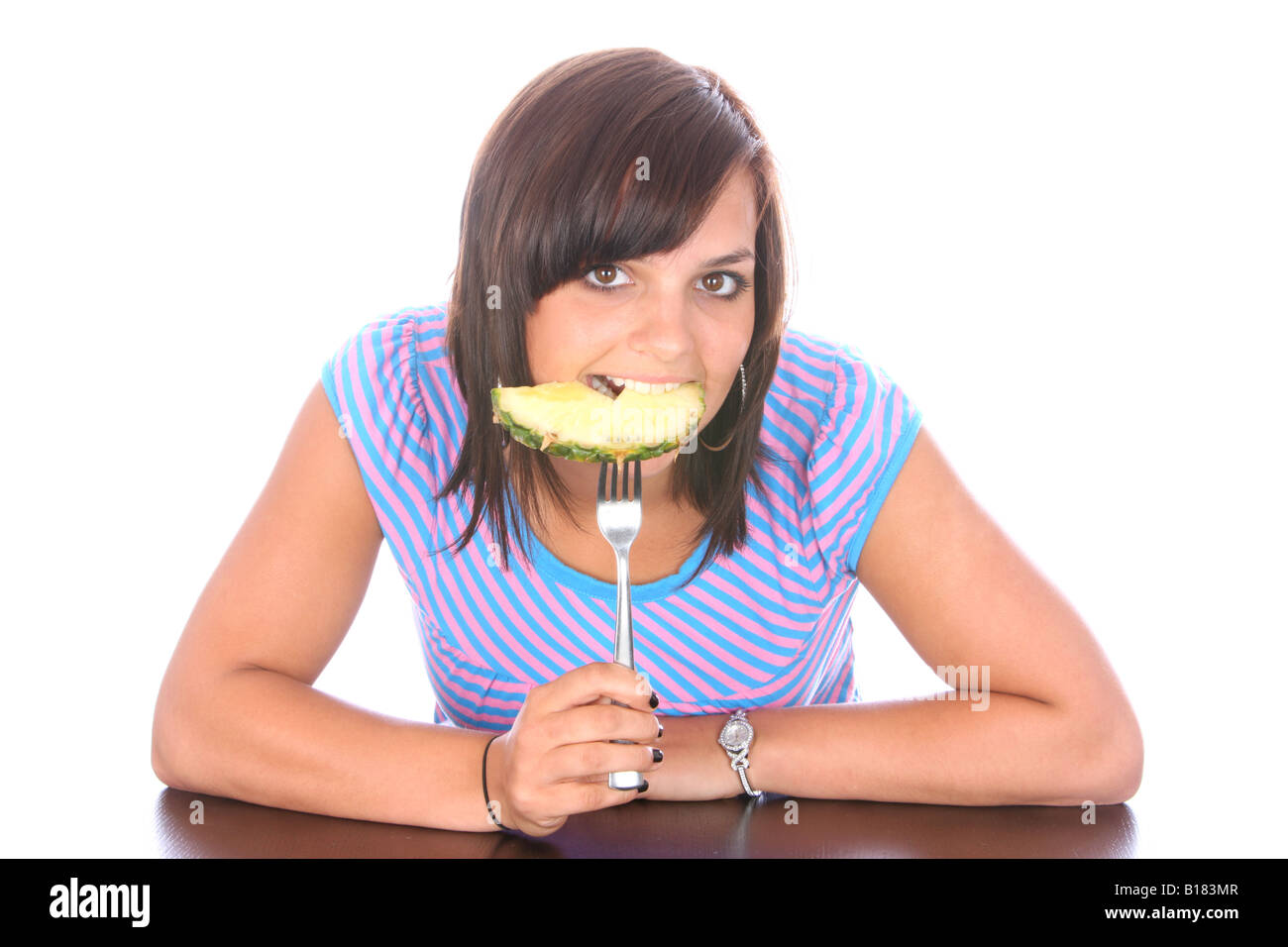 Young Woman Eating Pineapples Model Released Stock Photo - Alamy
