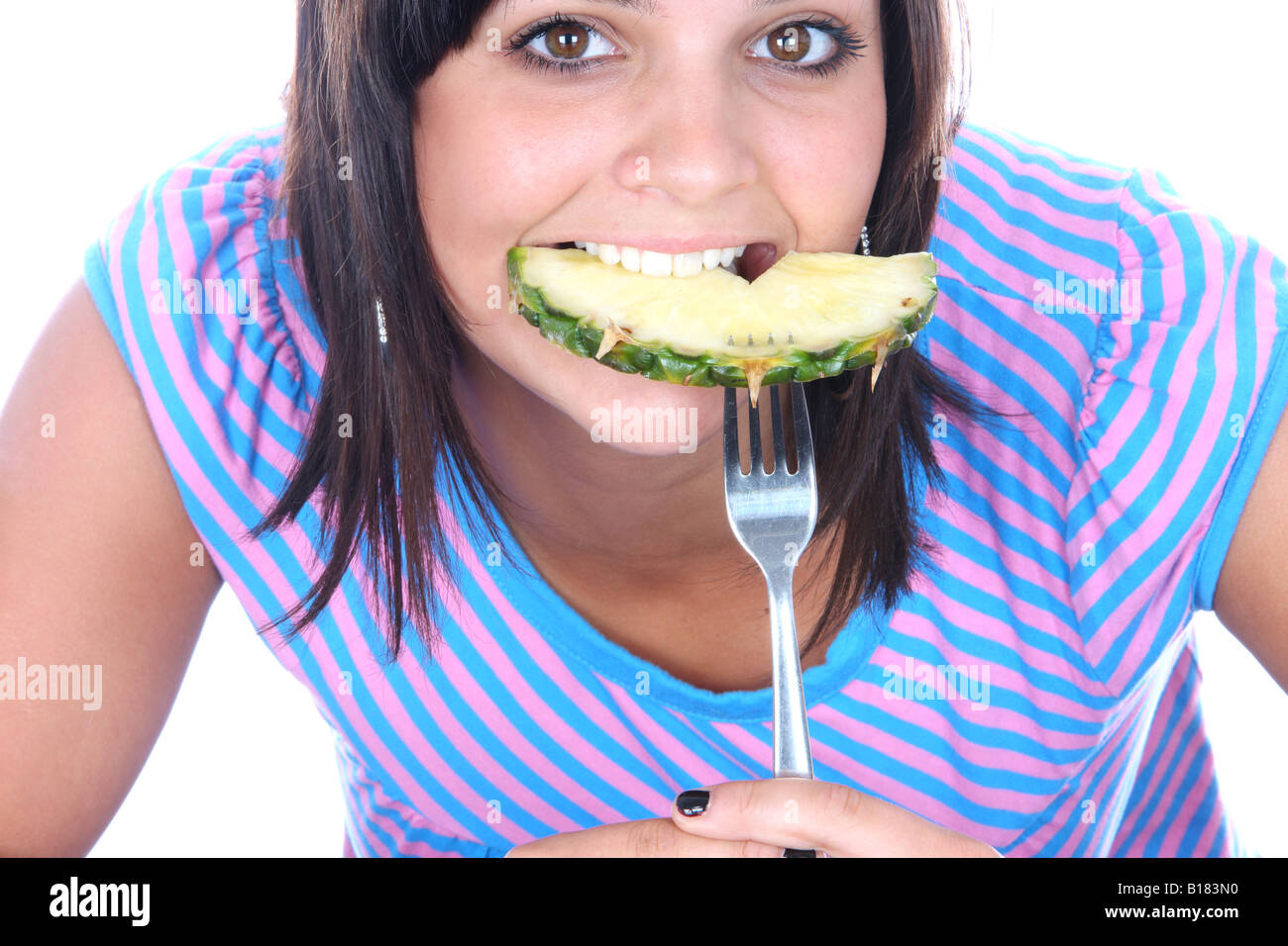 Young Woman Eating Pineapples Model Released Stock Photo - Alamy