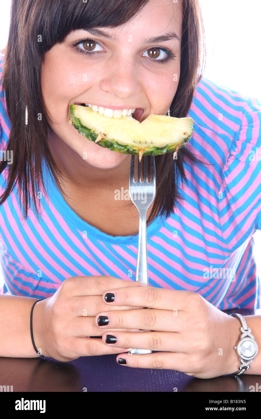 Young Woman Eating Pineapples Model Released Stock Photo - Alamy