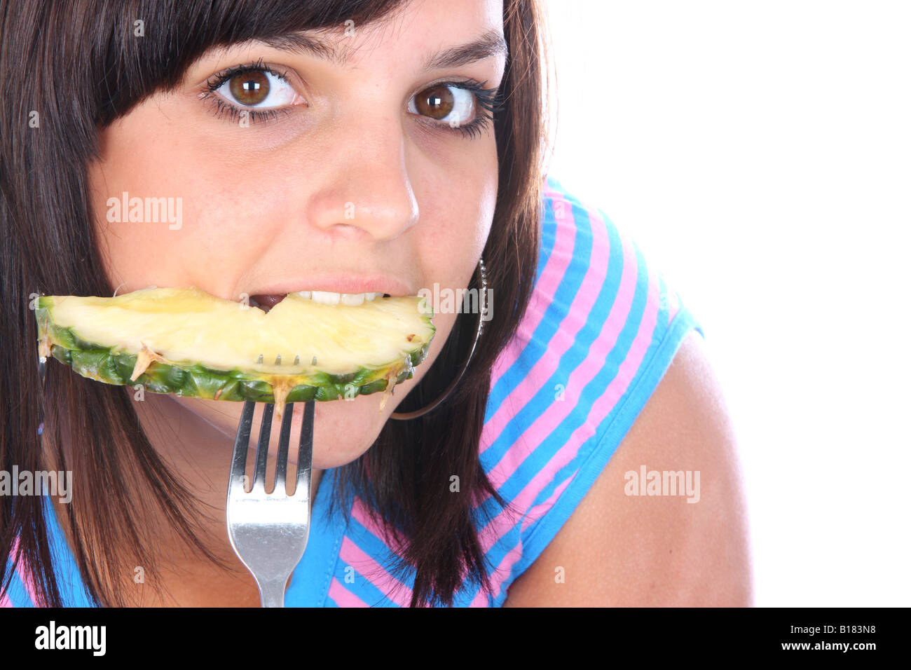 Young Woman Eating Pineapples Model Released Stock Photo - Alamy