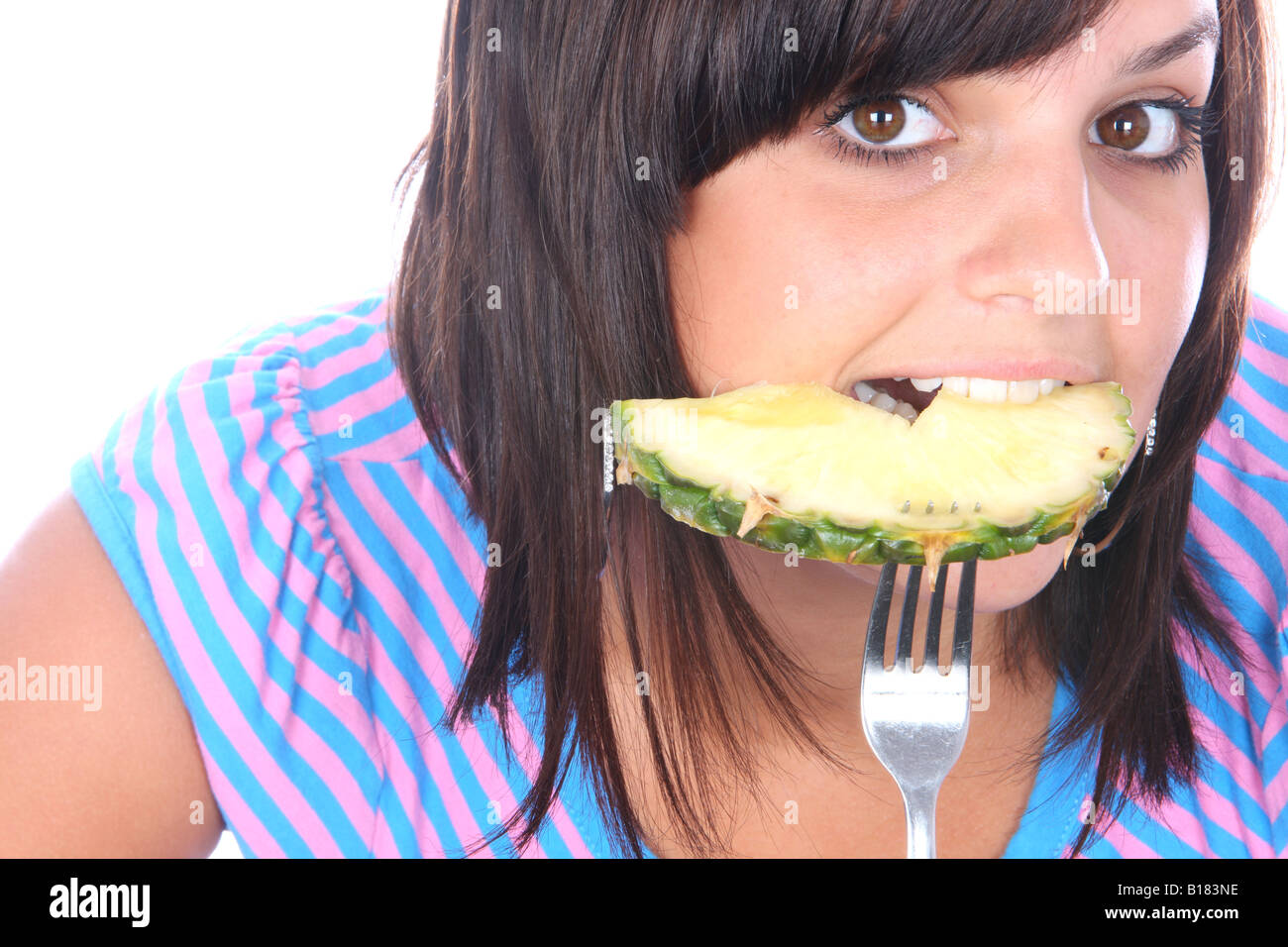 Young Woman Eating Pineapples Model Released Stock Photo - Alamy