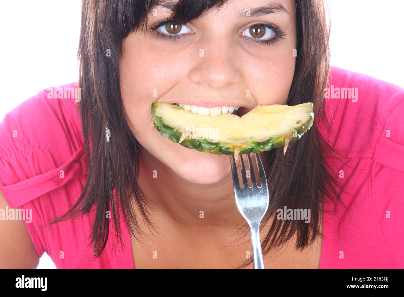 Young Woman Eating Pineapples Model Released Stock Photo - Alamy