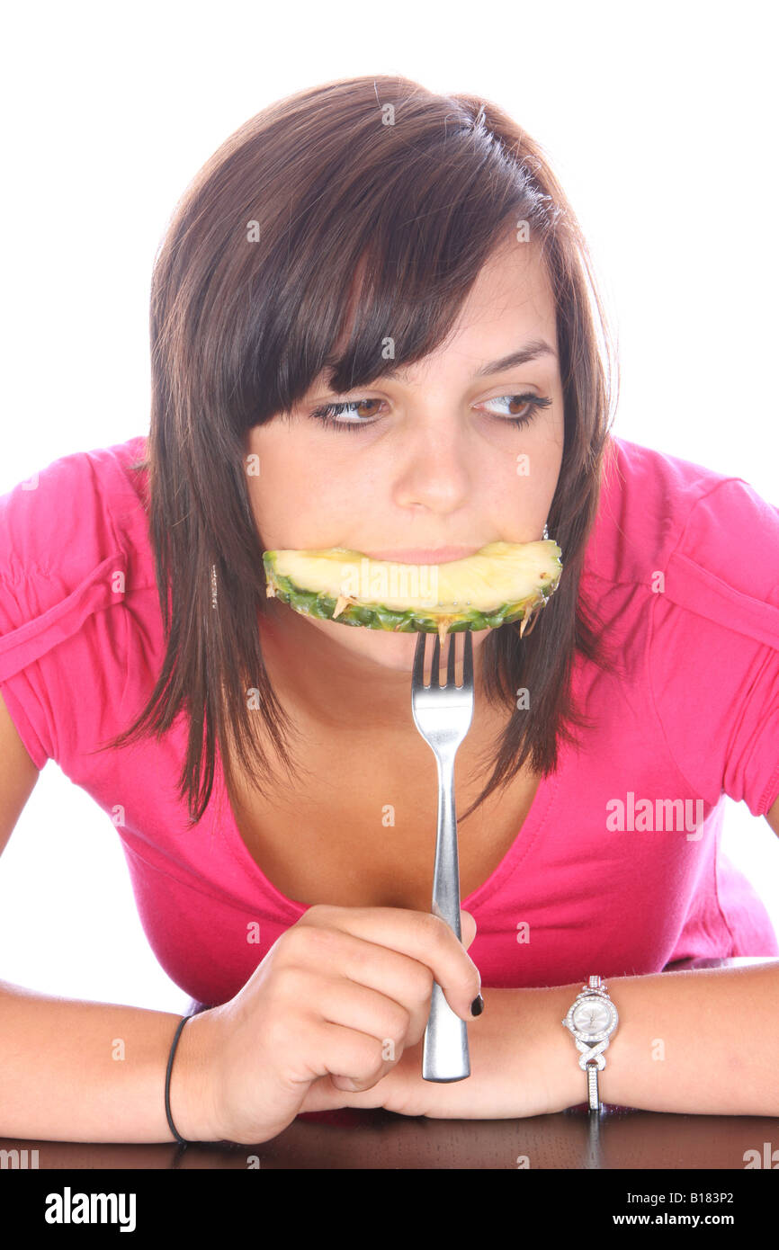 Young Woman Eating Pineapples Model Released Stock Photo - Alamy