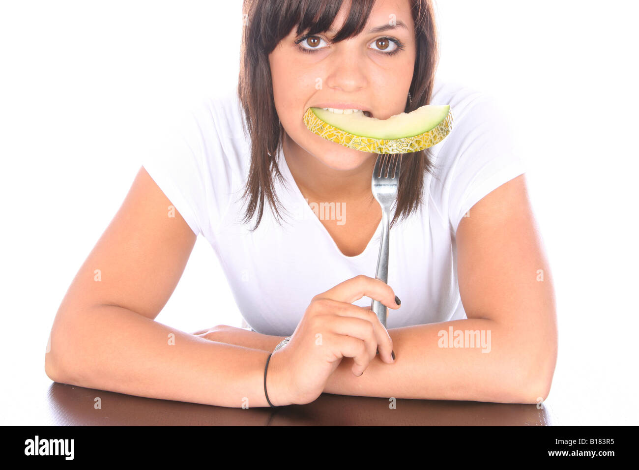 Young Woman Eating Slice of Melon Model Released Stock Photo - Alamy