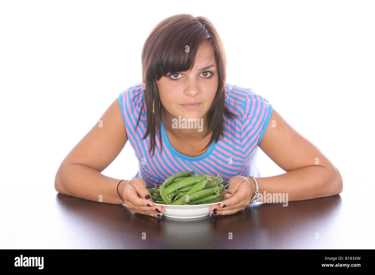 Young Woman Holding a Plate of Fresh Garden Peas Model Released Stock ...