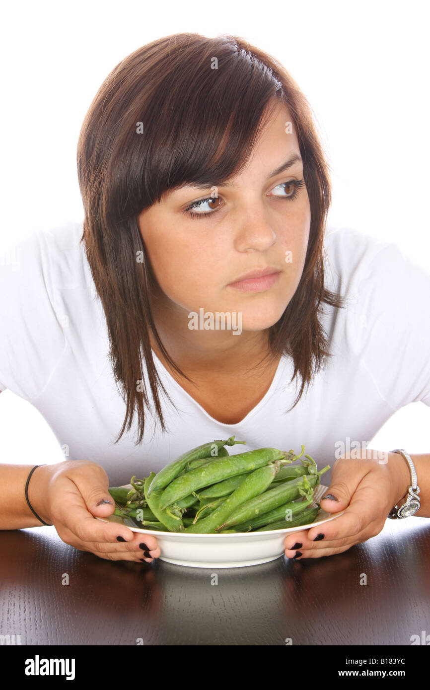 Young Woman Holding a Plate of Fresh Garden Peas Model Released Stock ...