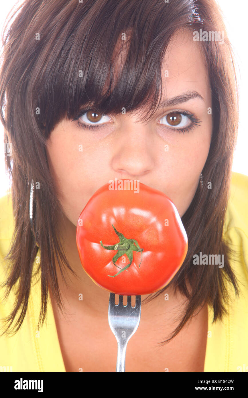 Young Woman Holding Beef Tomato Model Released Stock Photo - Alamy