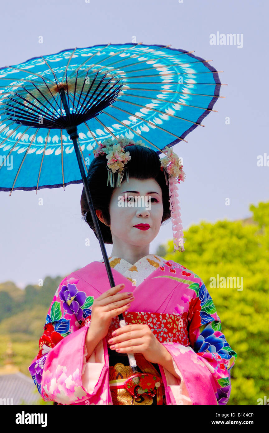 maiko apprentice geisha with umbrella at Kiyomizu Temple Kyoto Japan ...