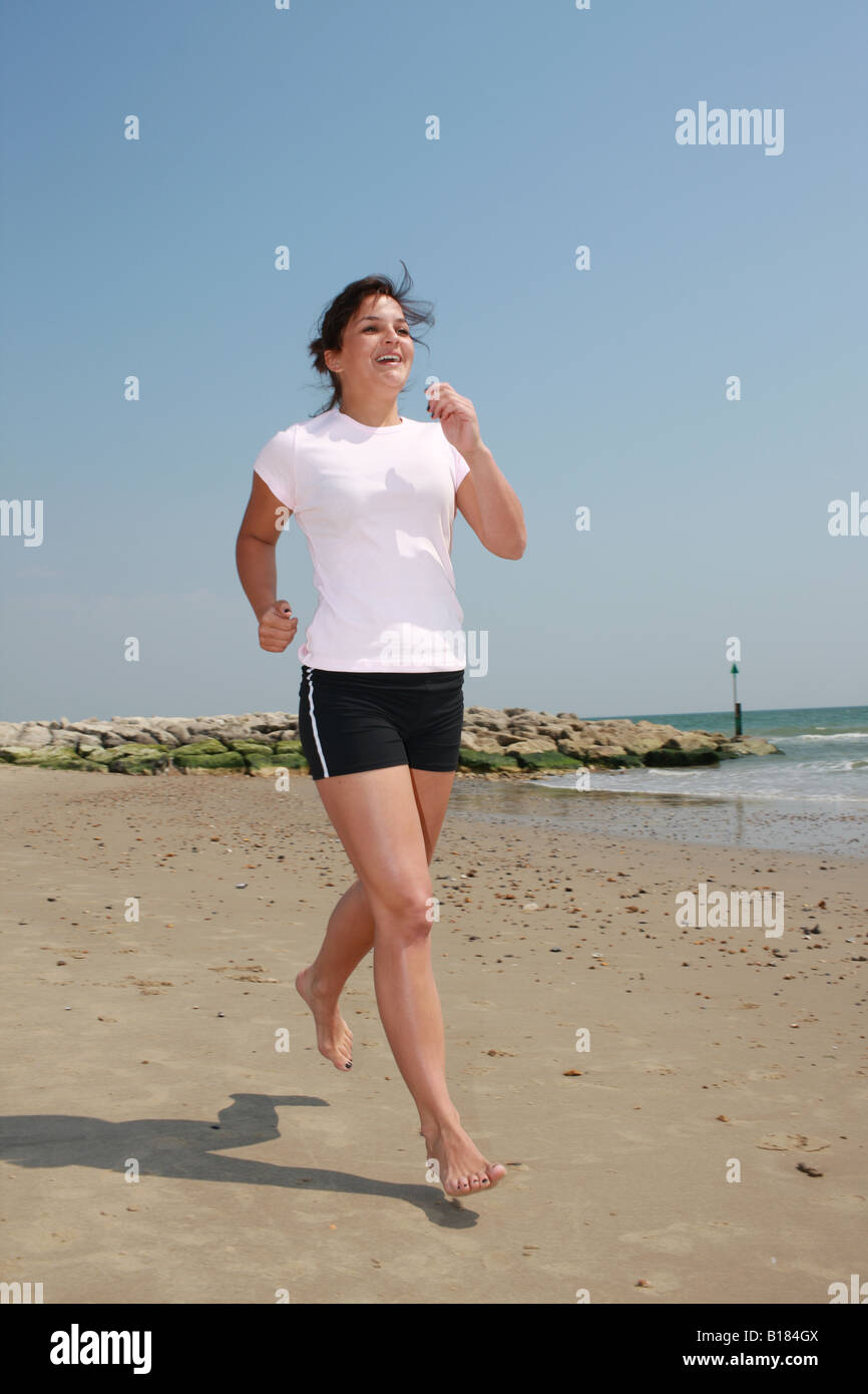 Happy Young Woman Running Model Released Stock Photo - Alamy