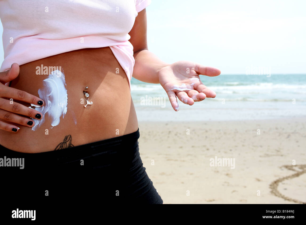 Teen Girl Sun Tan Lotion High Resolution Stock Photography and Images ...