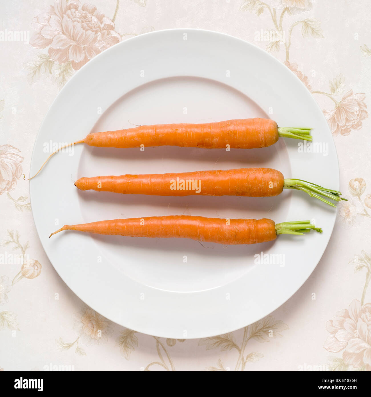 Carrots on plate, elevated view Stock Photo - Alamy