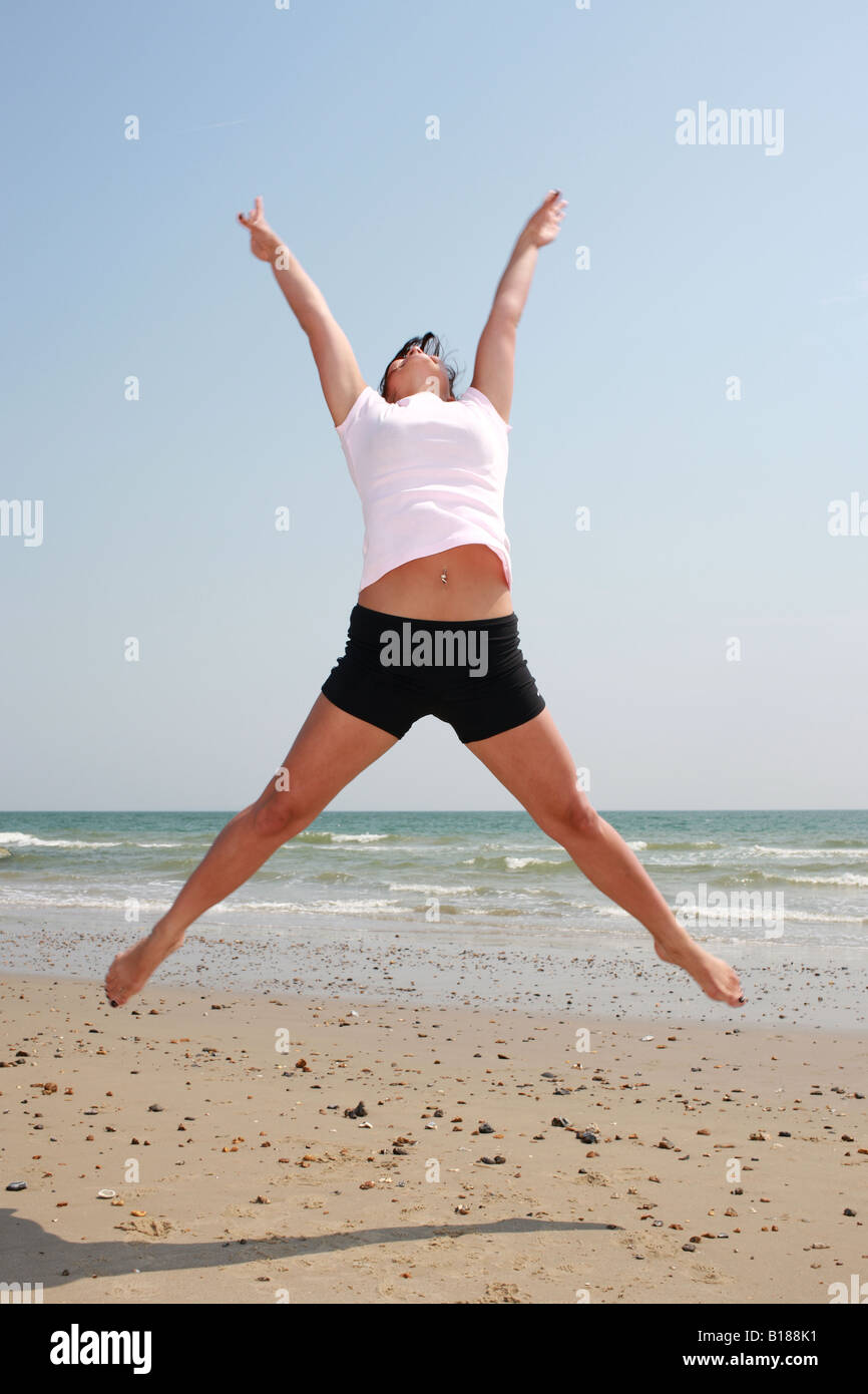 Young Woman Jumping Model Released Stock Photo - Alamy