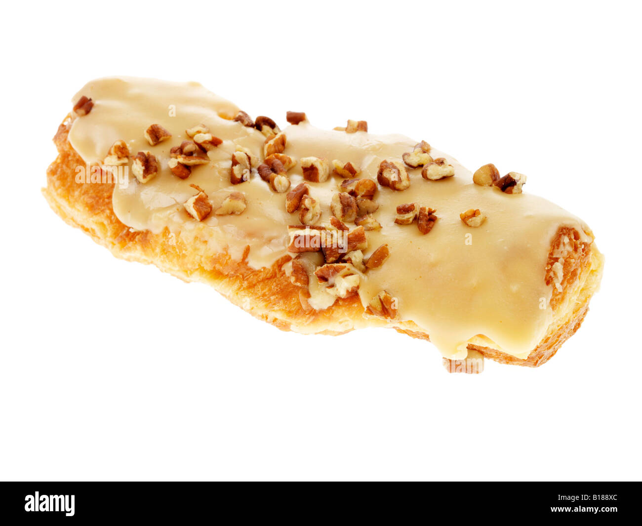 Single Walnut And Butterscotch Iced Pastry Twist Isolated Against A ...