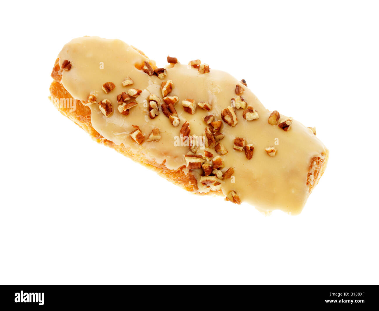 Single Walnut And Butterscotch Iced Pastry Twist Isolated Against A ...