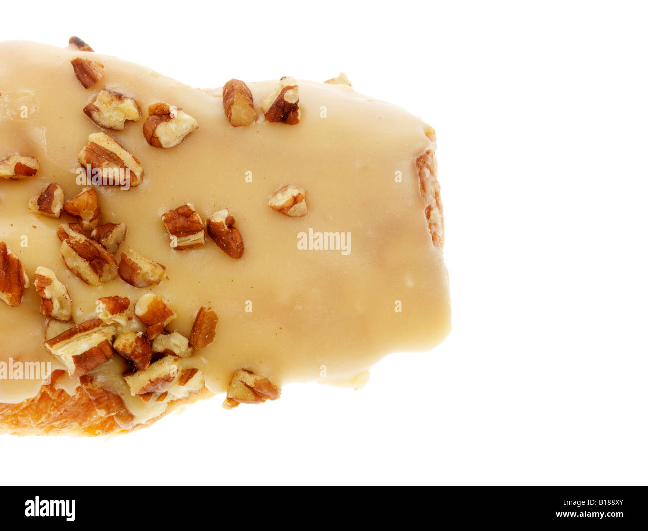 Single Walnut And Butterscotch Iced Pastry Twist Isolated Against A ...