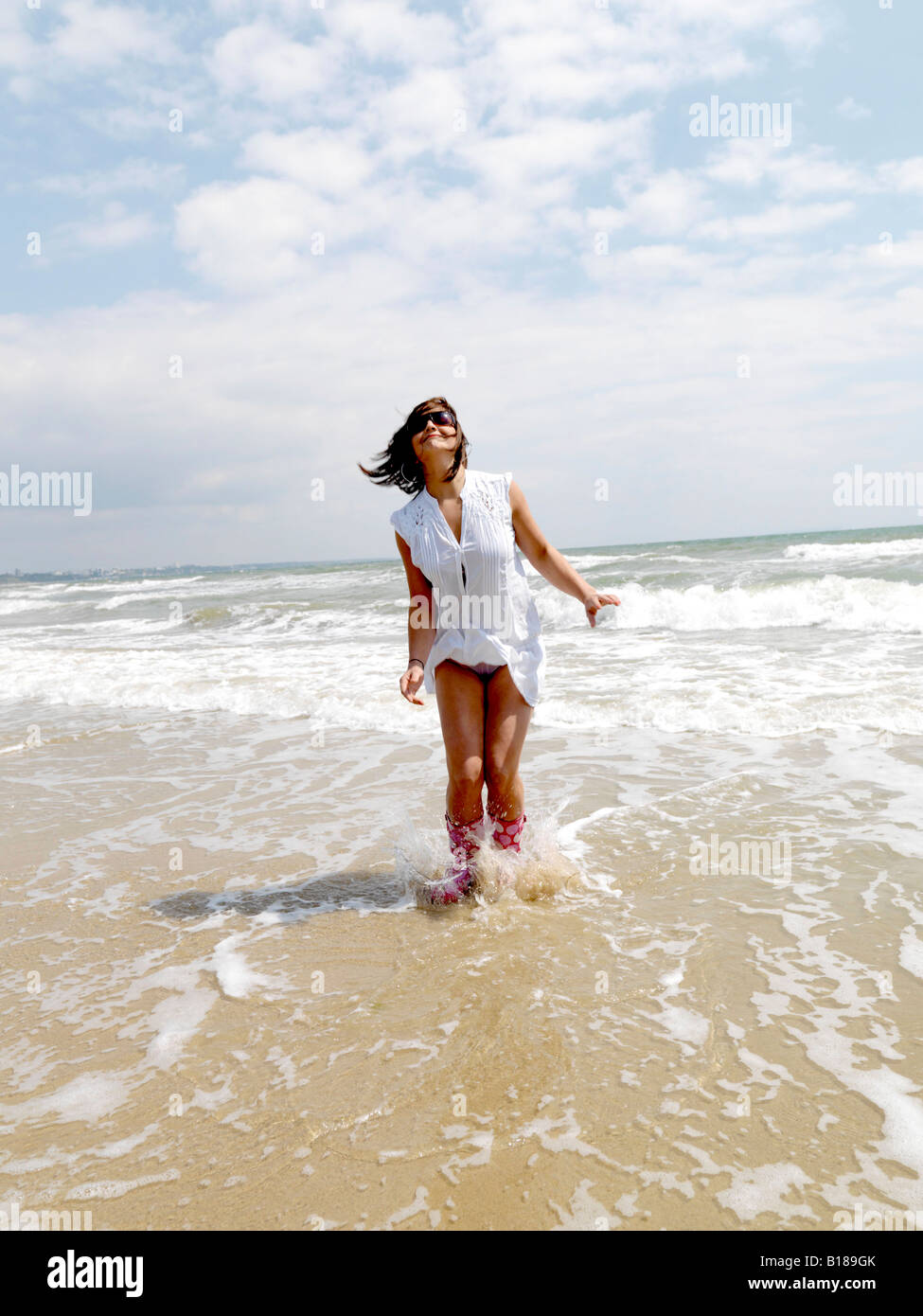Young Woman Jumping in the Sea Model Released Stock Photo - Alamy