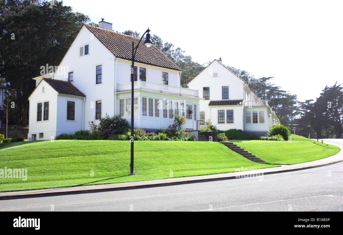 White family home with grass front yard Stock Photo - Alamy