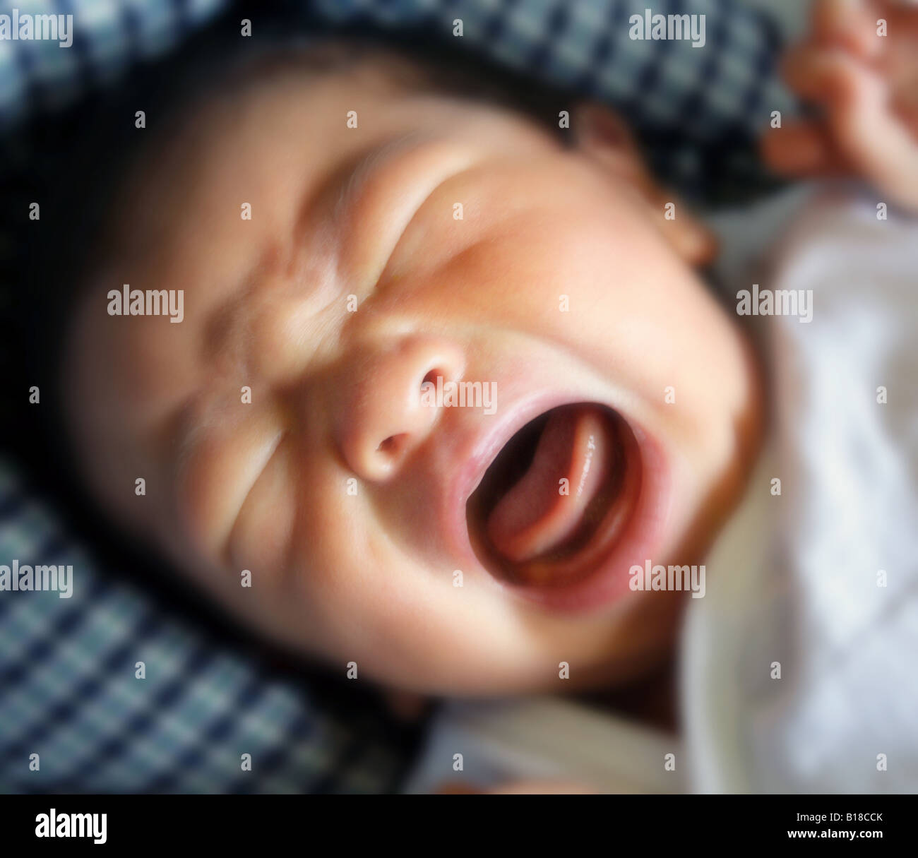 Baby crying facial expression Stock Photo - Alamy