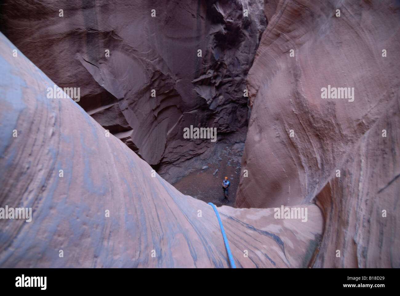 Rope hanging down a cave for canyoning on the slick roack trail near ...