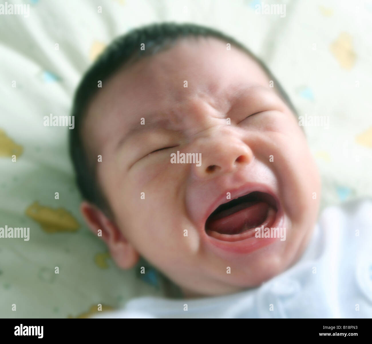 Baby crying facial expression Stock Photo - Alamy