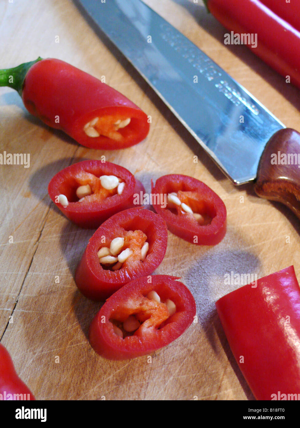 red chili peppers being prepared Stock Photo - Alamy