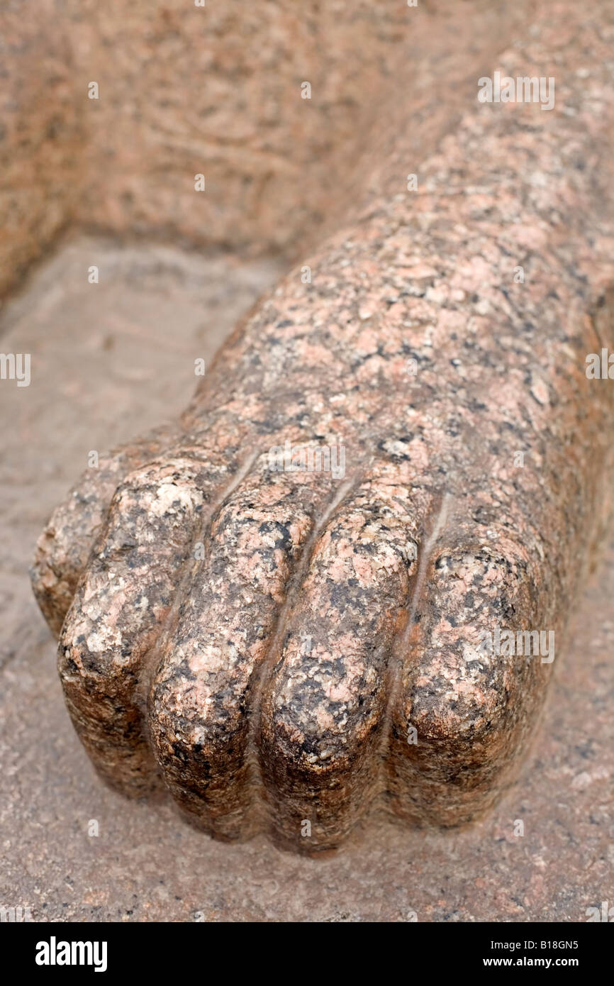 The foot of a carving of a sphinx in the courtyard of the Egyptian ...
