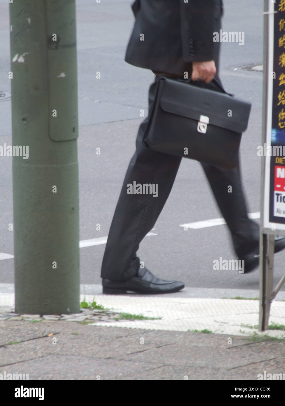 one person walking in street in city town Stock Photo - Alamy