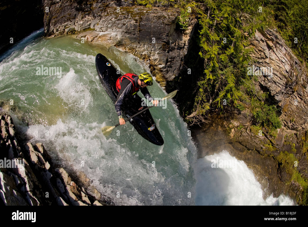 A kayaker running the 60 foot Sutherland Falls, Revelstoke, British ...