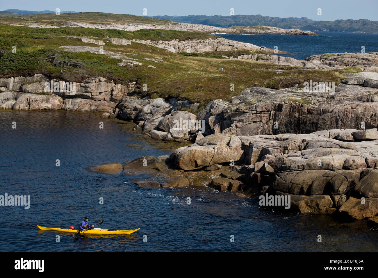 A kayaker navagating the South Coast, Newfoundland, Canada Stock Photo ...