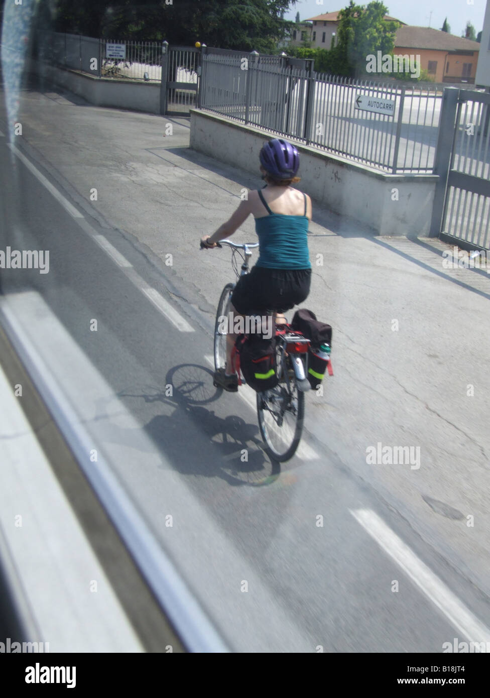 one person riding bike in city street Stock Photo - Alamy