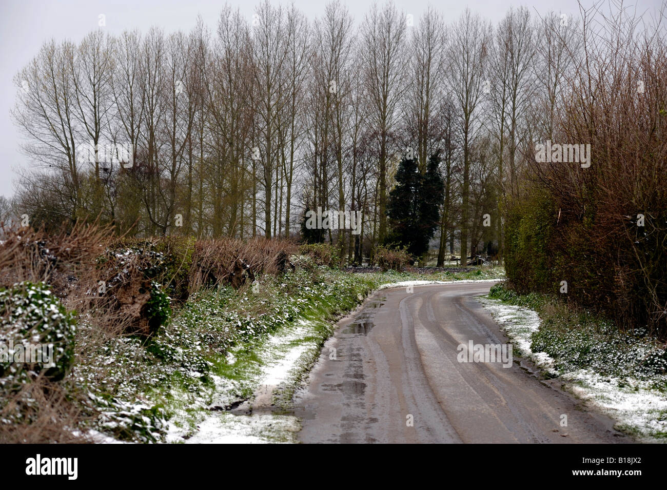 Slush covered winter minor road between Ellingham and Mettingham ...