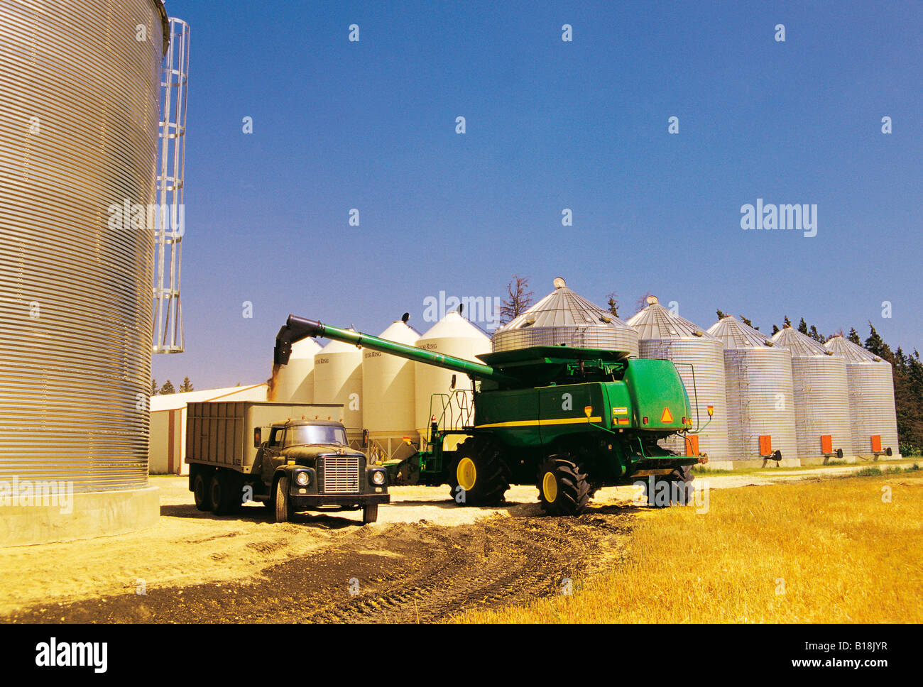 Truck unloading grain bins hi-res stock photography and images - Alamy