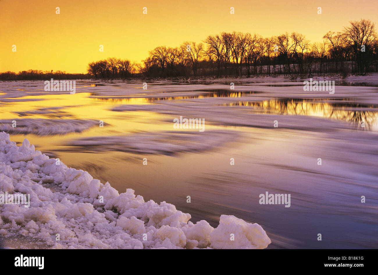 newly formed ice moving along the Red River, near Winnipeg, Manitoba ...