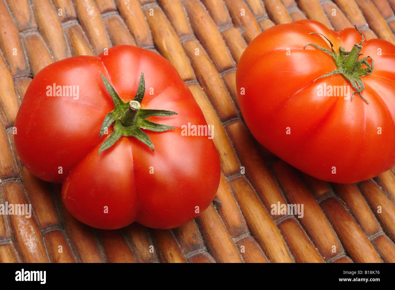 two red tomatoes Stock Photo - Alamy