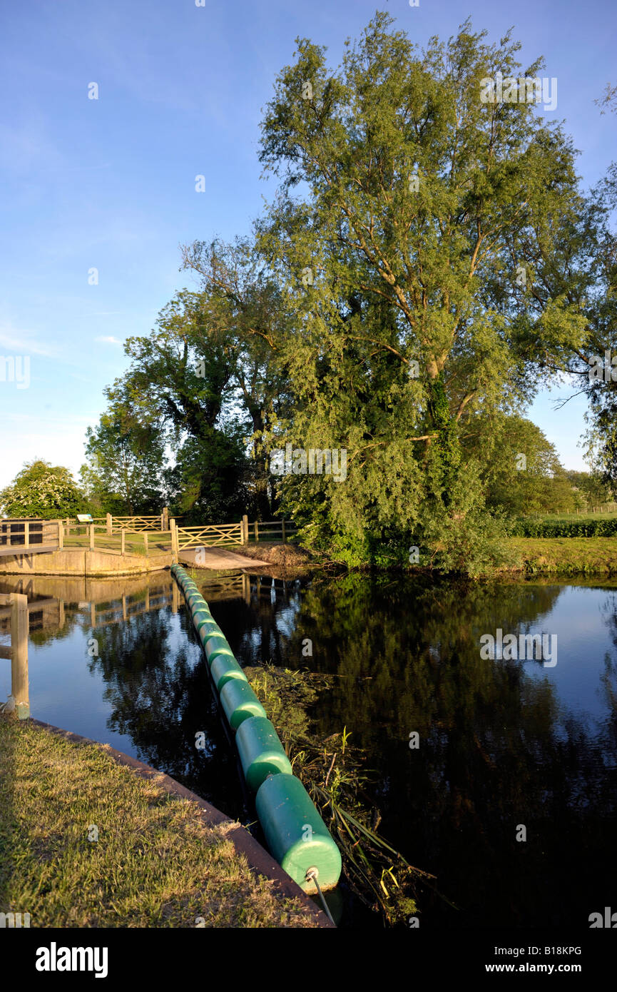 weed boom collecting weed from river Waveney at Ellingham On the ...
