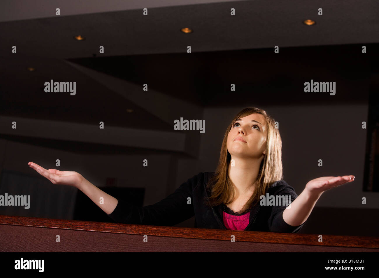 Young woman with her arms raised Stock Photo - Alamy