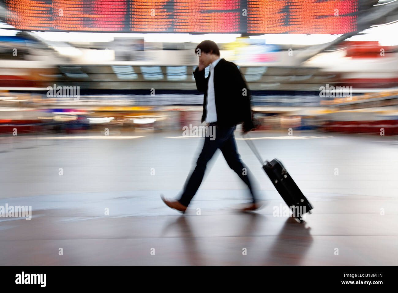 Young man running airport hi-res stock photography and images - Alamy