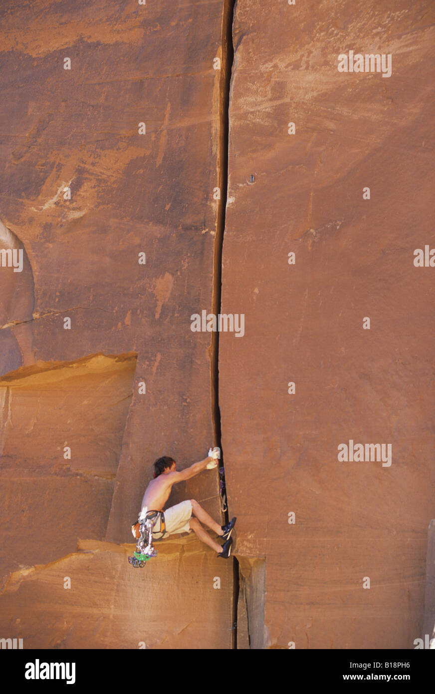 A climber making his way up this sandstone crack climb, Big Guy, Indian ...