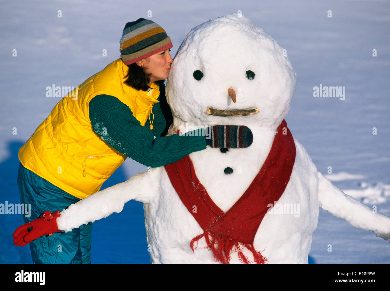 a woman kisses a snowman Winnipeg Manitoba Canada Stock Photo - Alamy