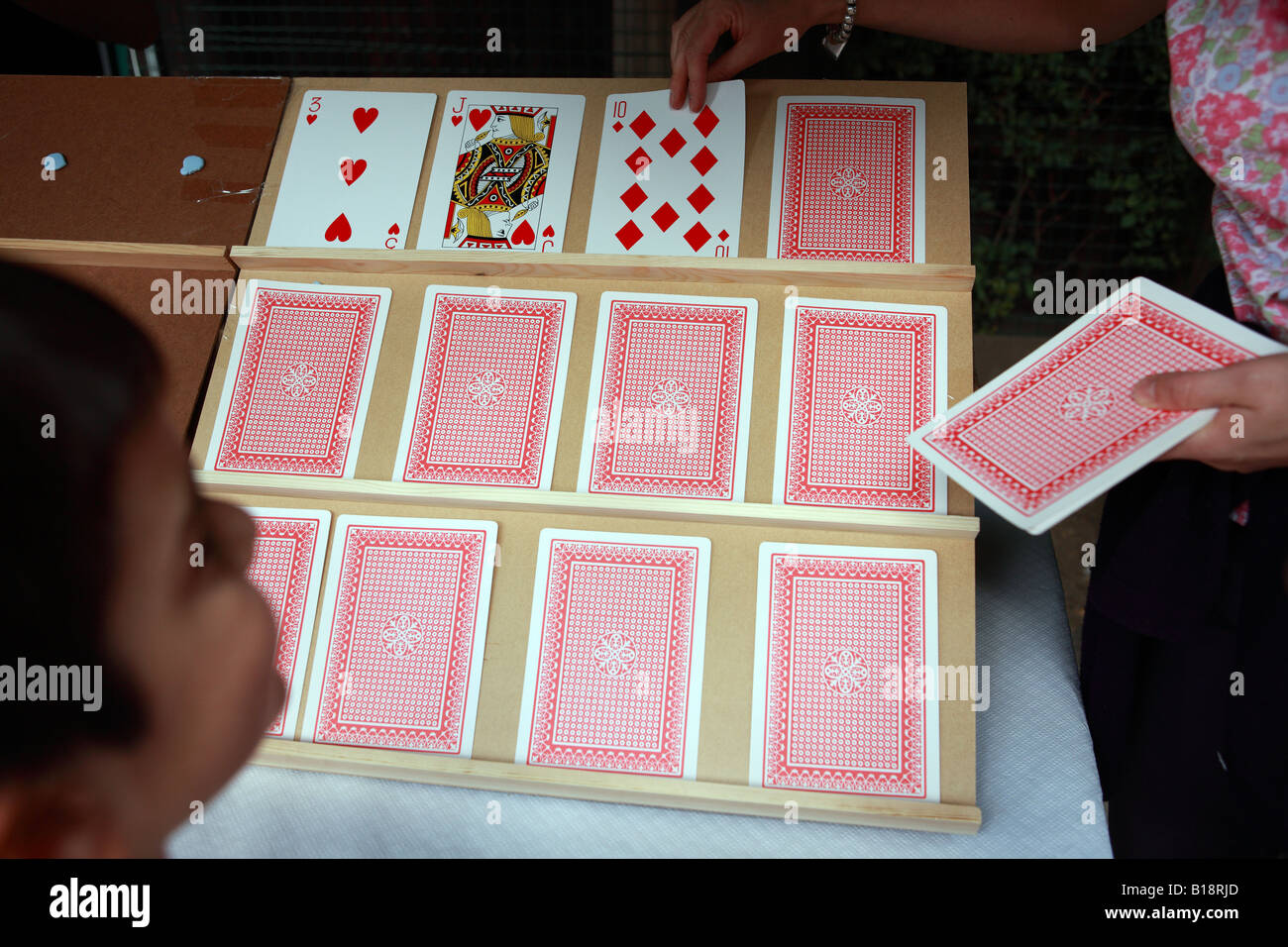 Playing cards being used for games, at a school summer fair Stock Photo ...