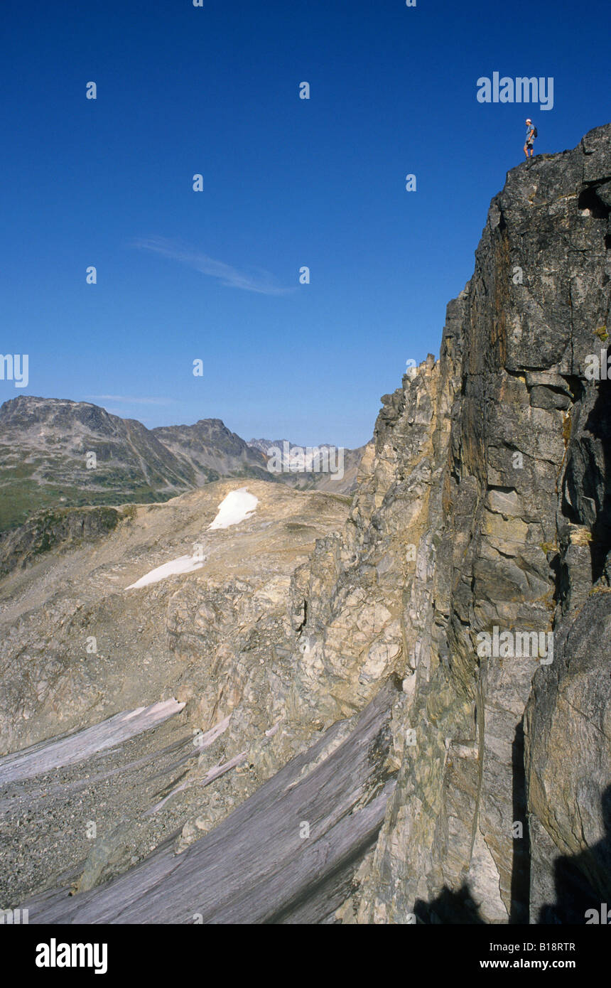 Man standing atop cliff. Figure of 8 Lake area. Lizzy Creek Trail ...