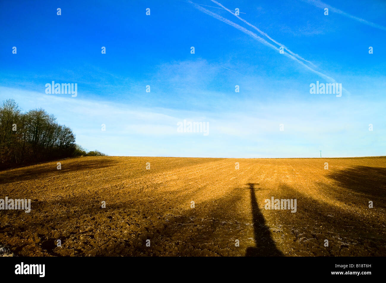 shadows over plowed field in morning light Stock Photo - Alamy