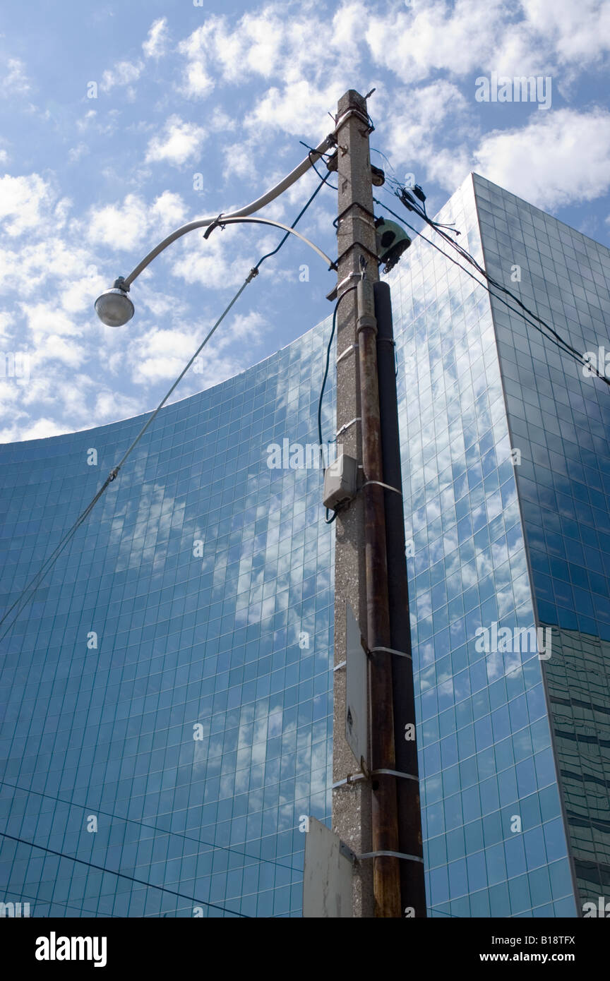 Modern glass office tower with utility pole Stock Photo - Alamy