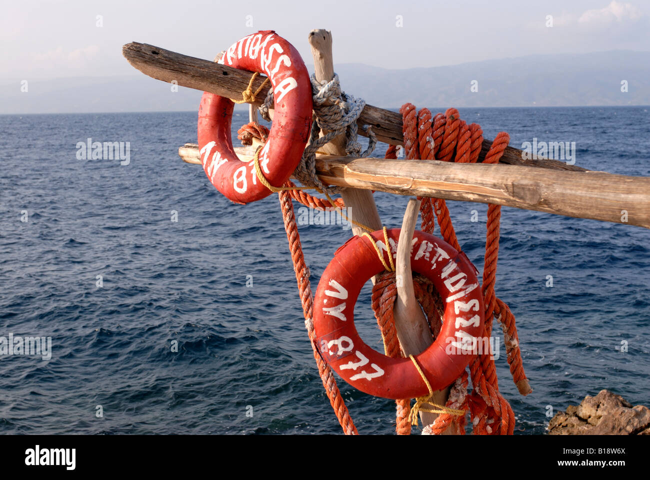 Red Life saving rings on Hydra island Greece Stock Photo - Alamy