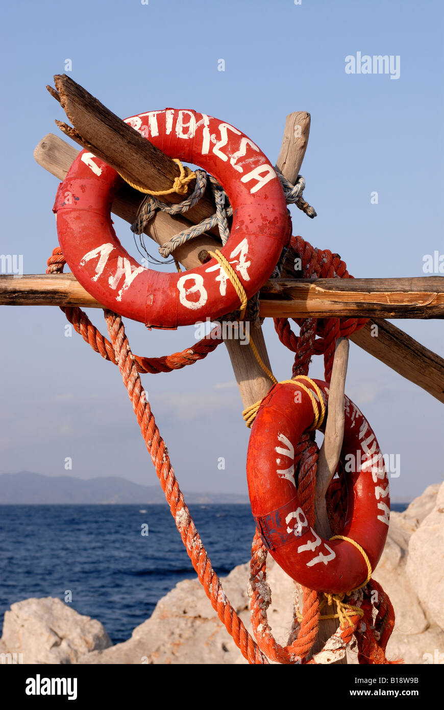 Red Life saving rings on Hydra island Greece Stock Photo - Alamy