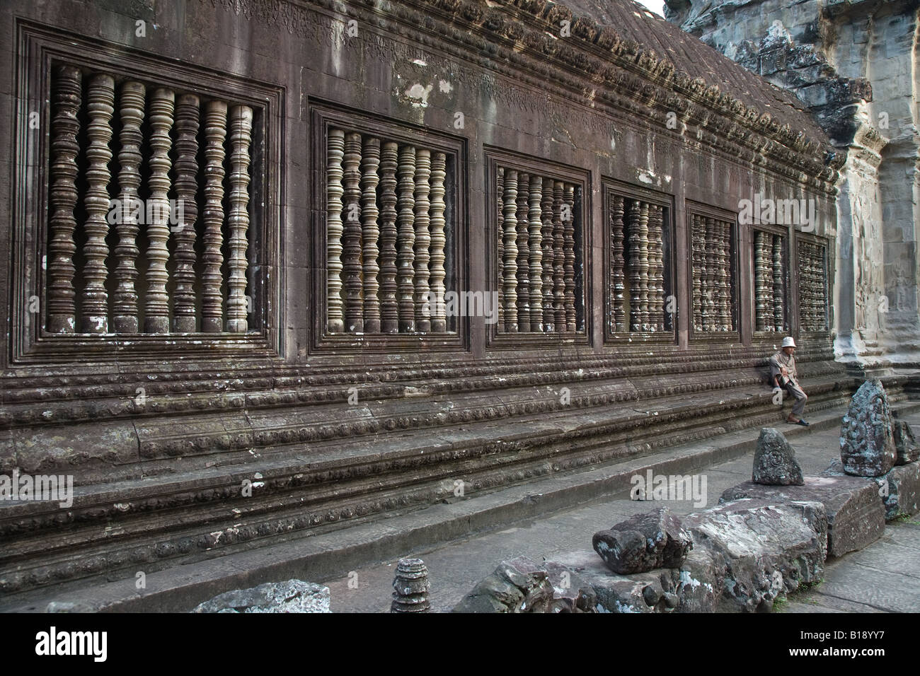 Security guard having a cigarette break in Angkor Wat Stock Photo - Alamy
