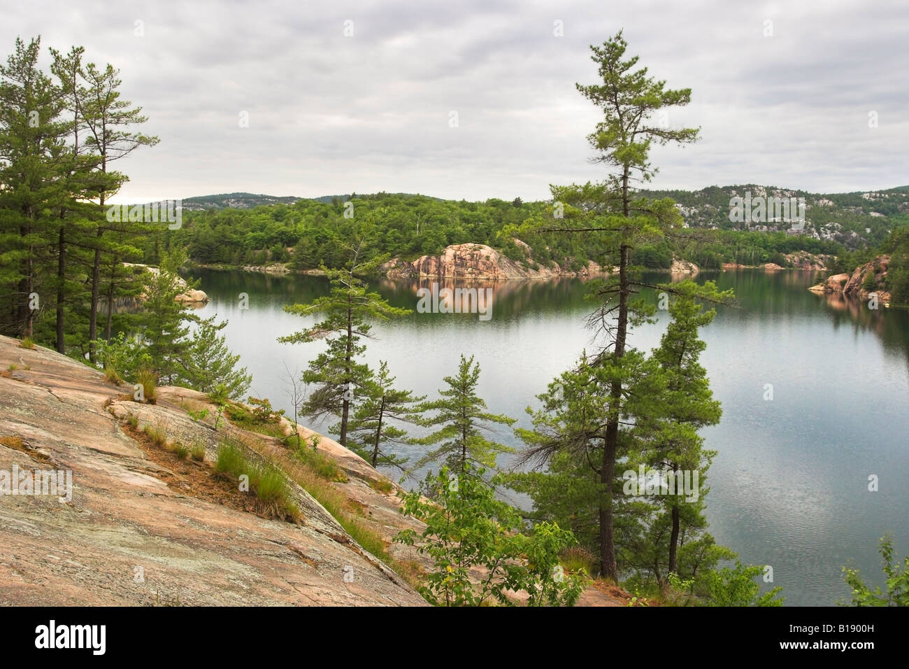 Granite cliffs and White pines typify the landscape in Killarney ...